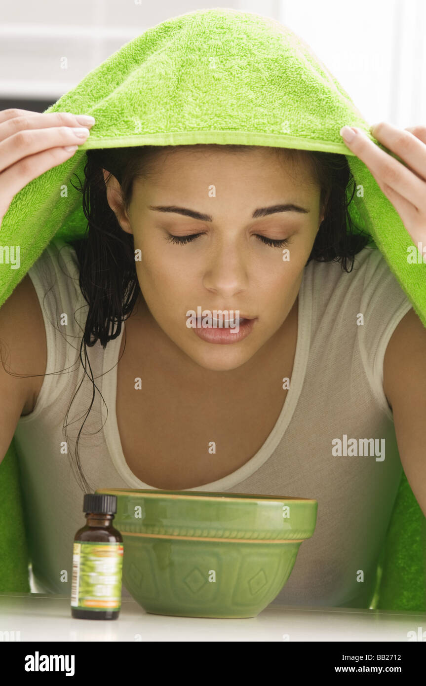 Woman inhaling over a bowl Stock Photo - Alamy