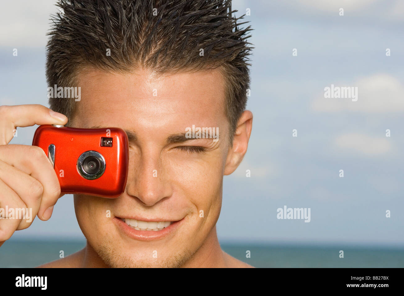 Man taking a picture with a digital camera Stock Photo - Alamy