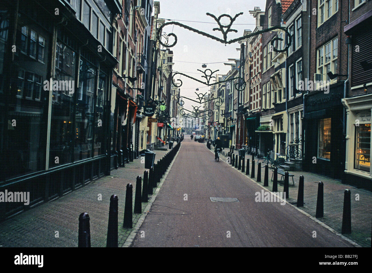 Europe, The Netherlands, Amsterdam. Amsterdam city scene in winter snow ...
