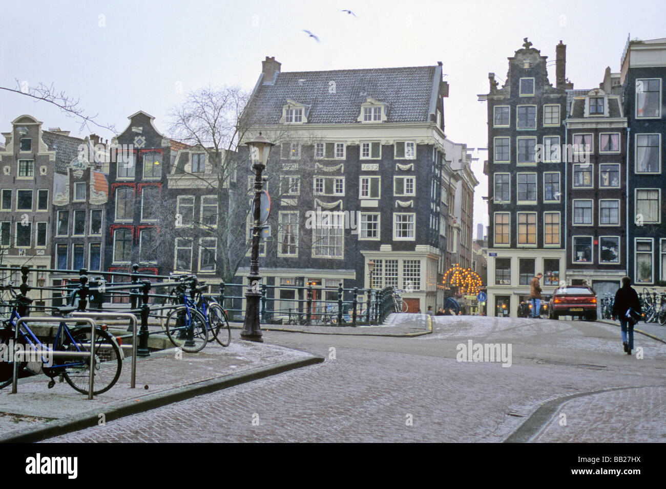 Europe, The Netherlands, Amsterdam. Amsterdam city scene in winter snow ...
