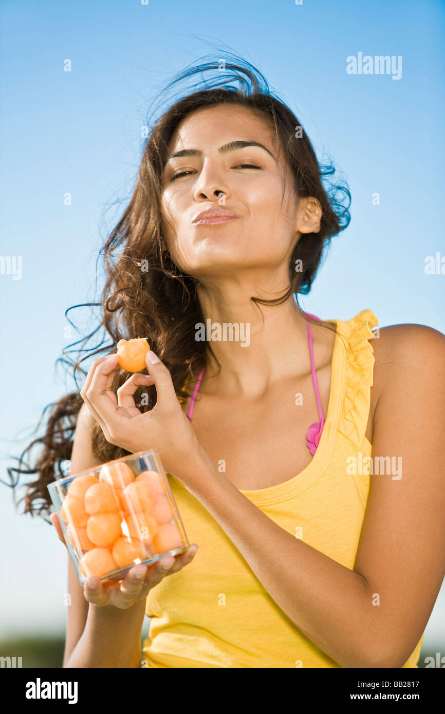 Woman eating fruits Stock Photo - Alamy