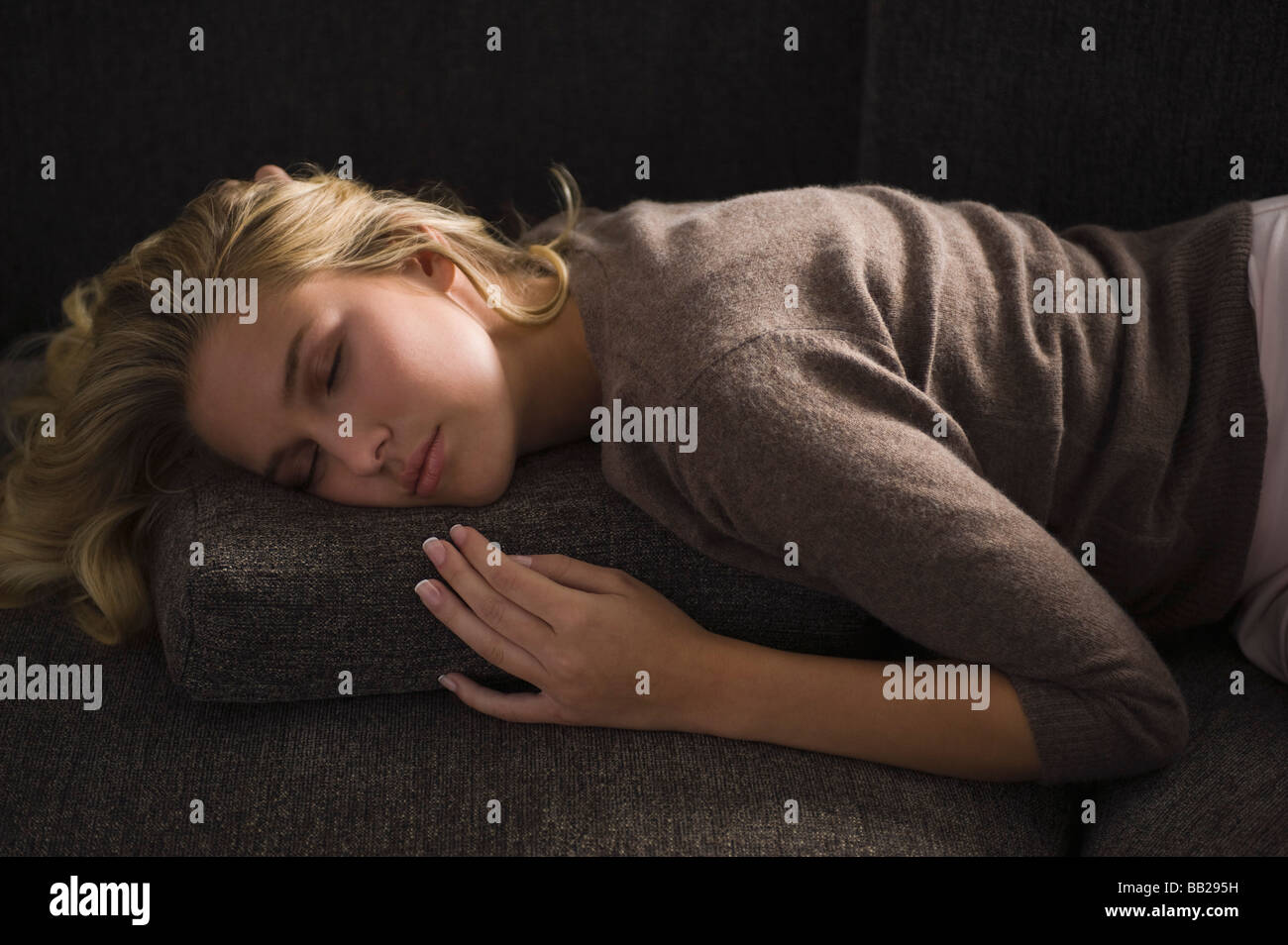 Woman sleeping couch night hi-res stock photography and images - Alamy