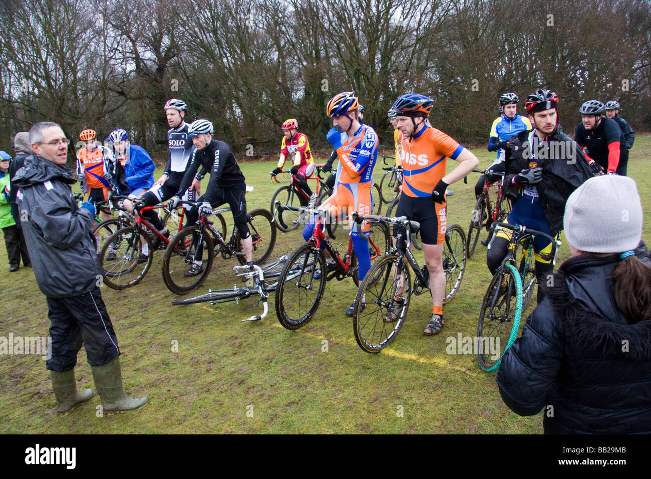 Riders line up on a wet day for the start of a cyclo cross Stock Photo ...