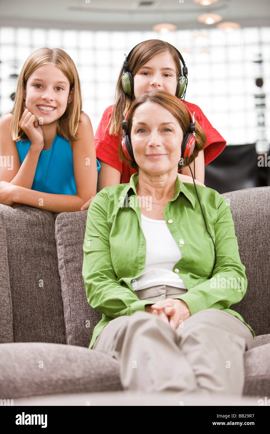 Family in a living room Stock Photo - Alamy