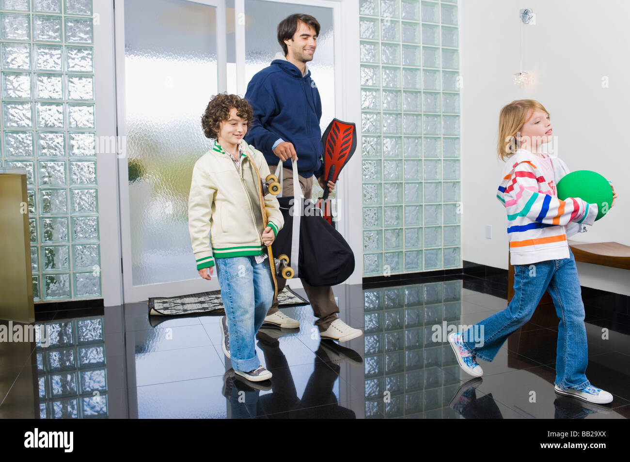 Three man entering house hi-res stock photography and images - Alamy