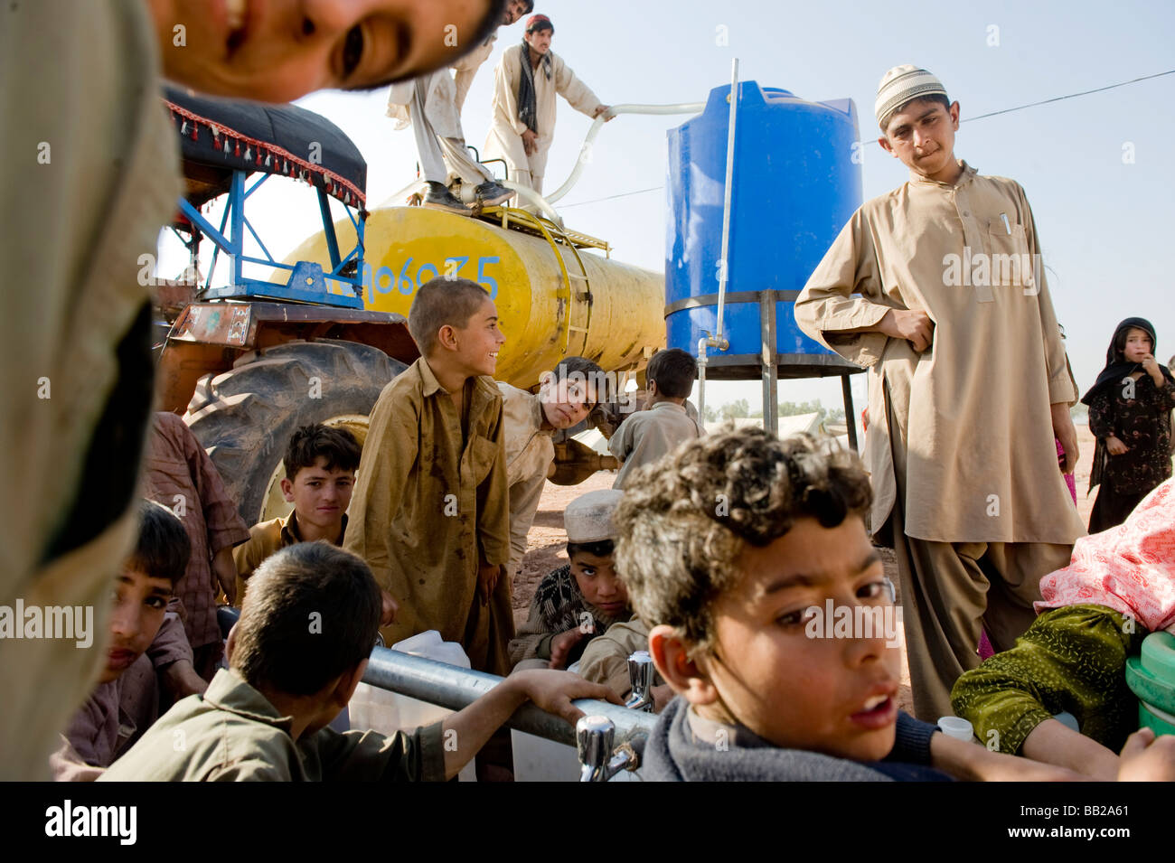 Collecting water in the war displaced camps in Peshawar, NWFP, Pakistan ...