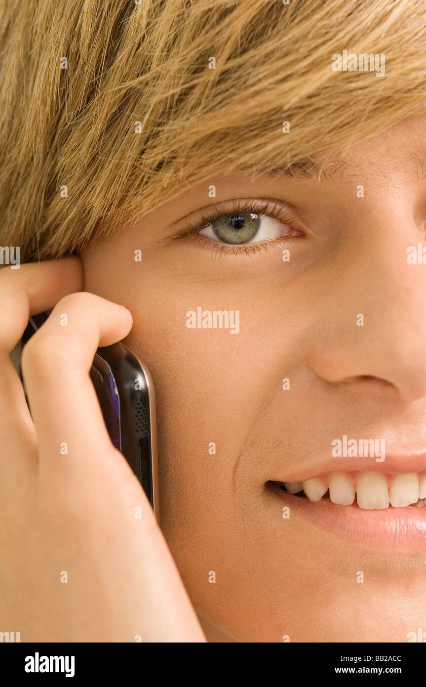 Teenage boy talking on a mobile phone Stock Photo - Alamy