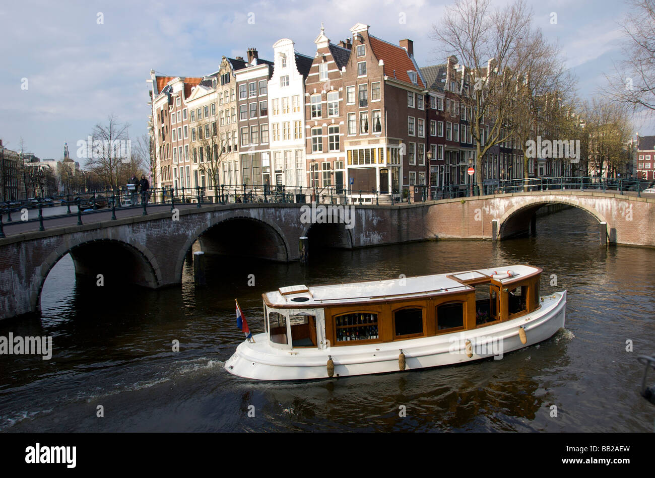 Europe, Netherlands, North Holland, canal boat in Amsterdam canal Stock ...