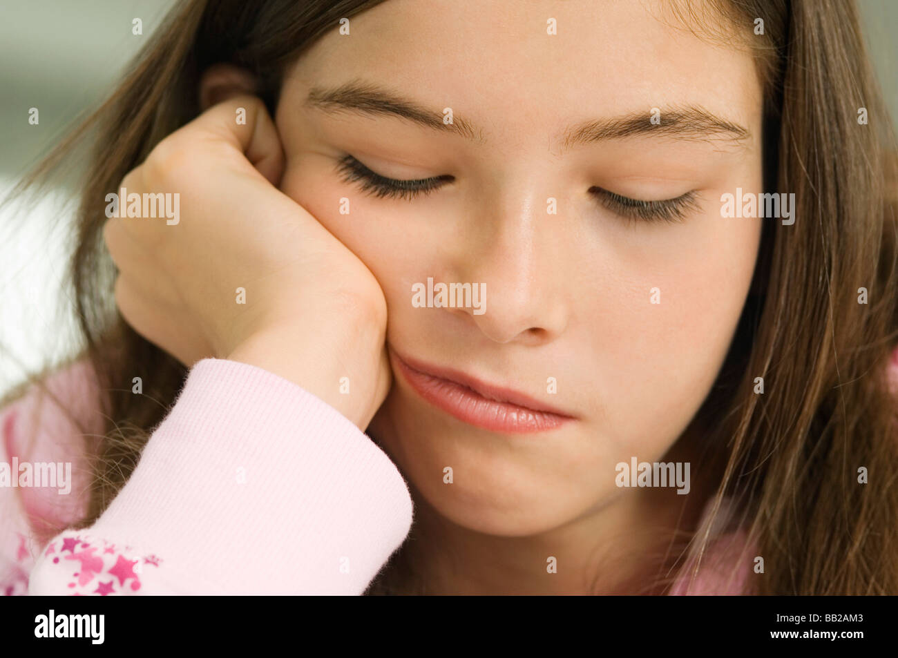 Close-up of a girl thinking Stock Photo - Alamy