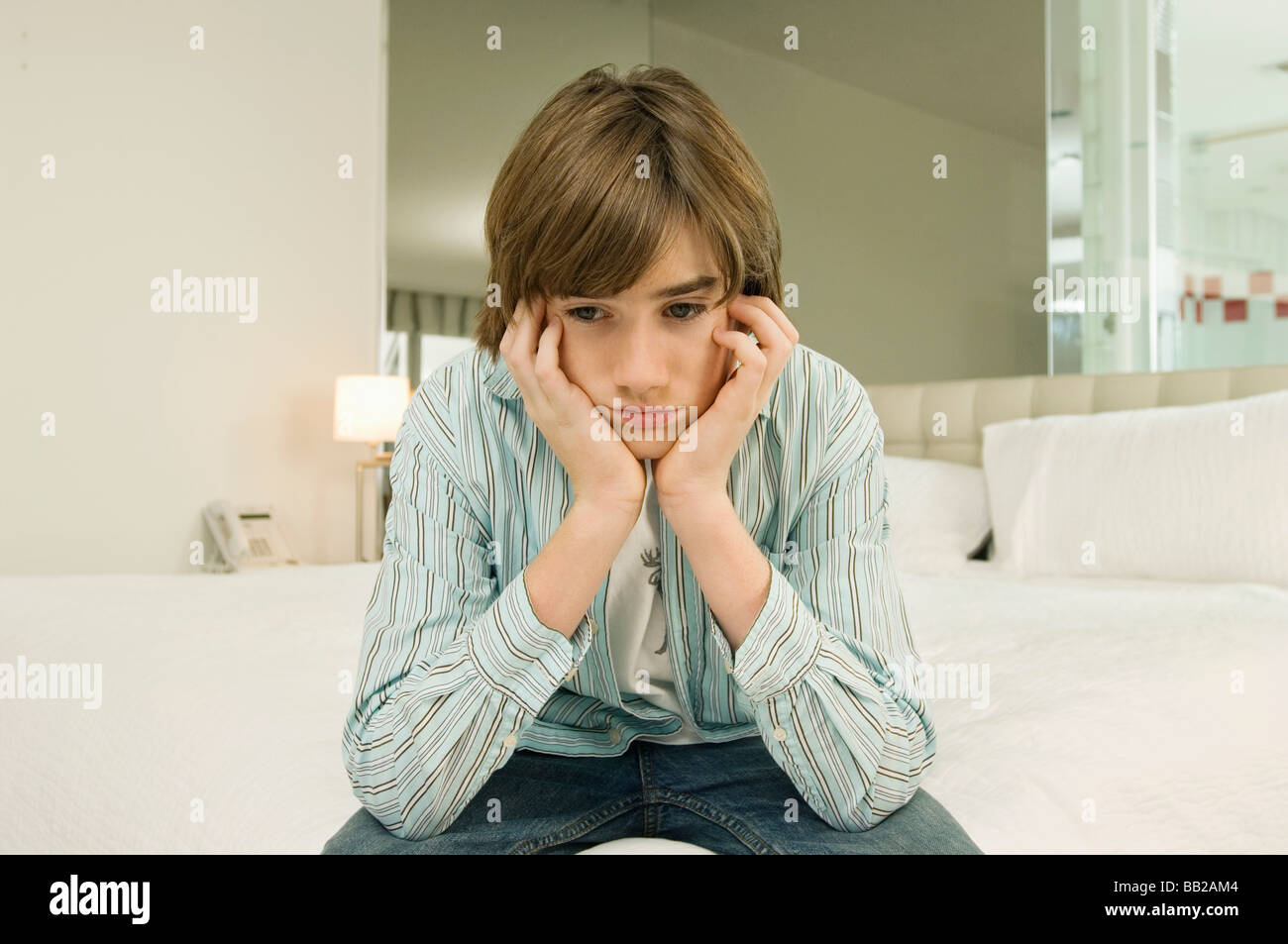 Boy looking serious Stock Photo - Alamy