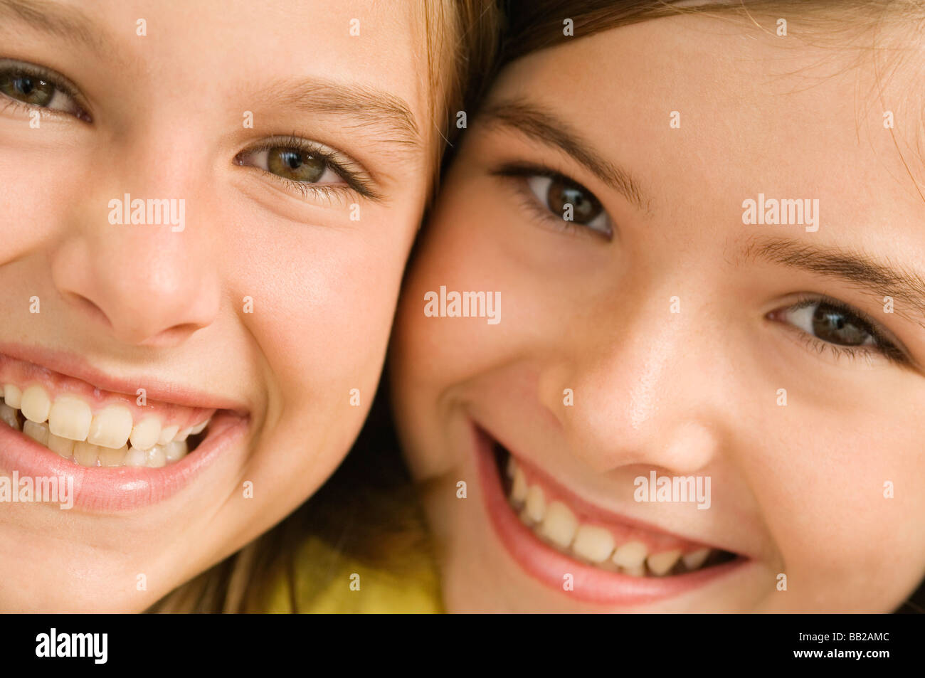 Portrait of two girls smiling Stock Photo - Alamy