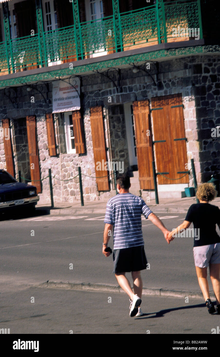 Caribbean, Dominica, Roseau. Traditional architecture and tourists ...