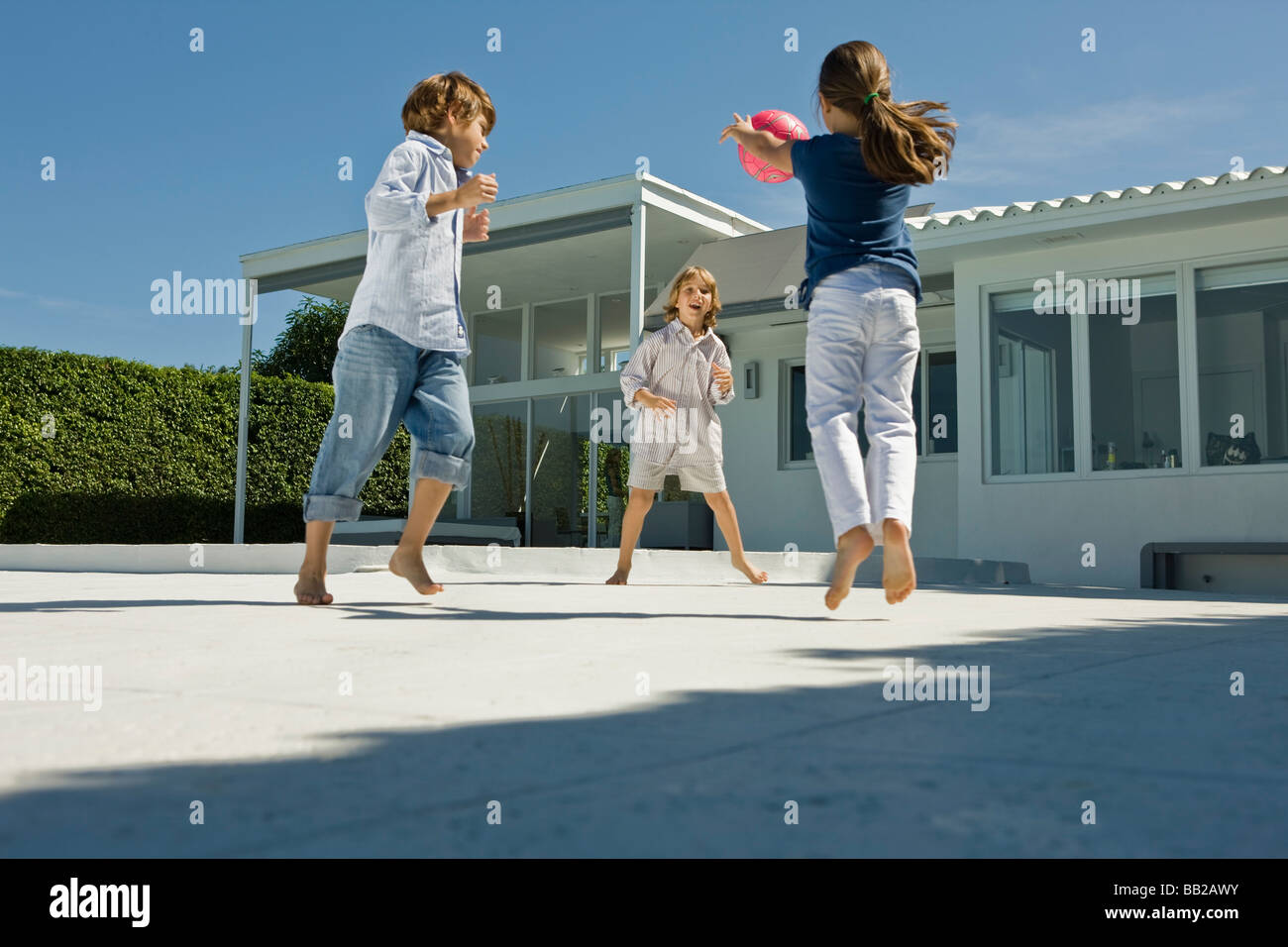 Children playing with a ball Stock Photo - Alamy
