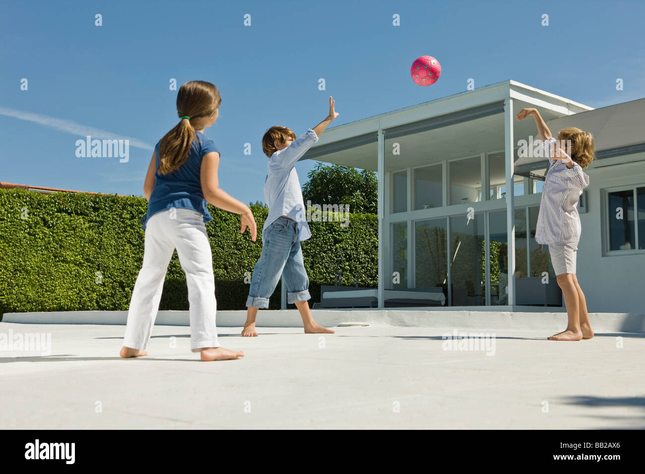 Children playing with a ball Stock Photo - Alamy
