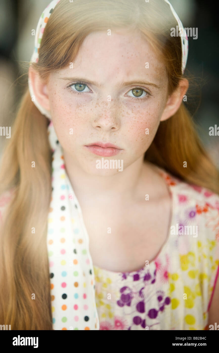 Portrait of a girl looking serious Stock Photo - Alamy