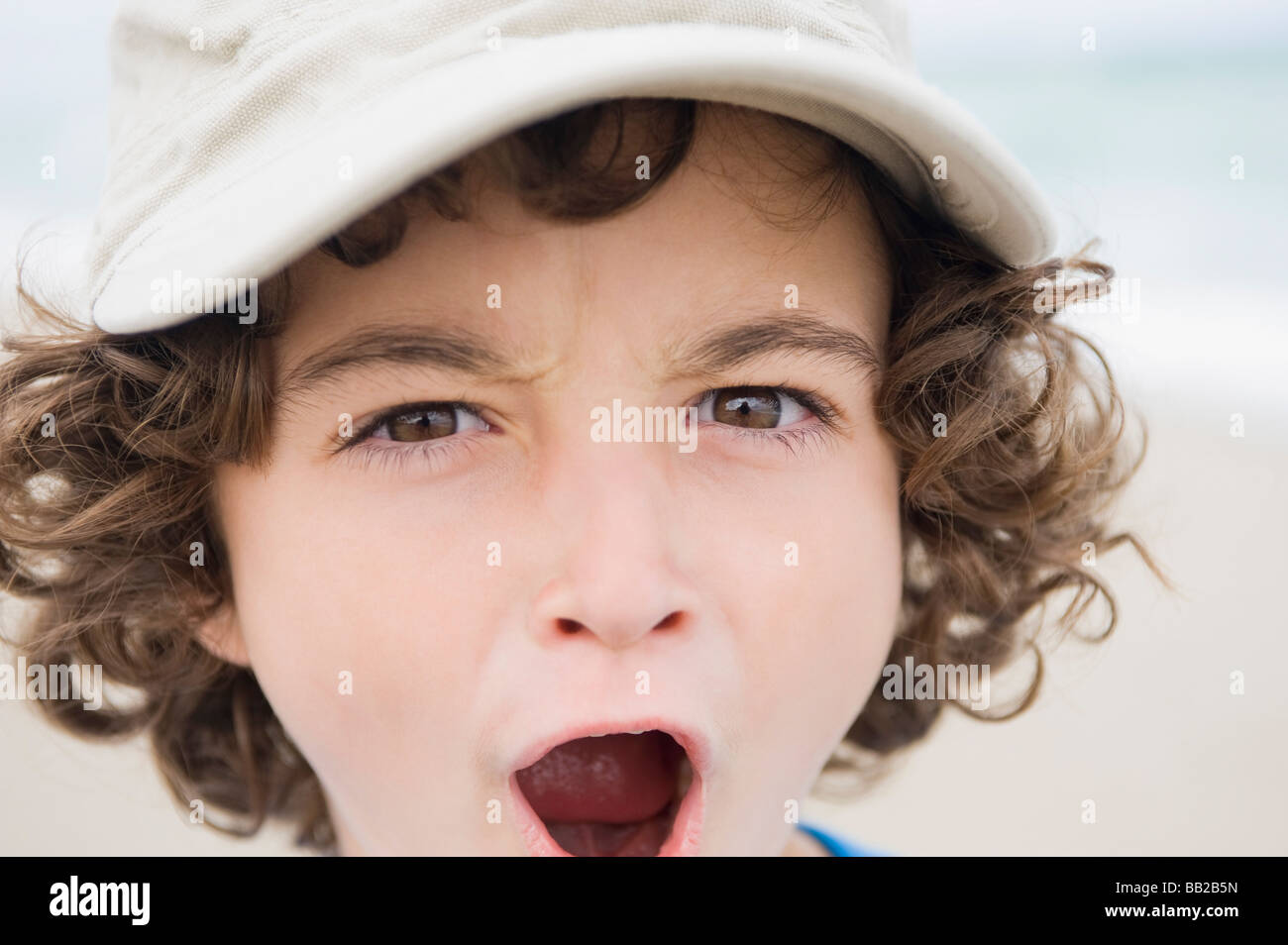 Portrait of a boy shouting Stock Photo - Alamy