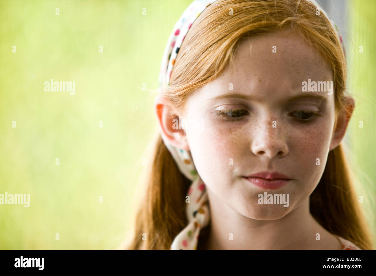 Close-up of a girl thinking Stock Photo - Alamy