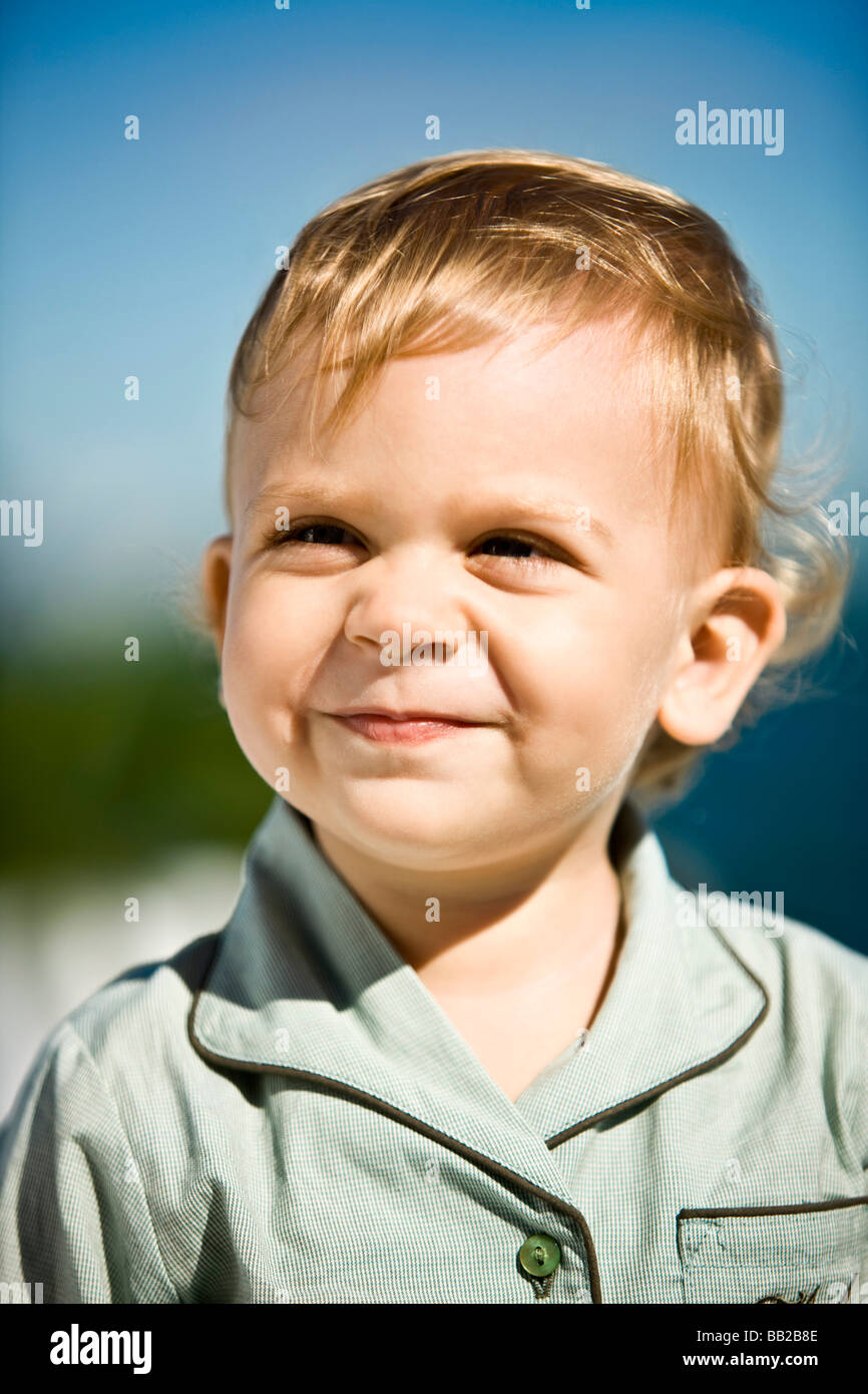 Close-up of a baby boy grinning Stock Photo - Alamy
