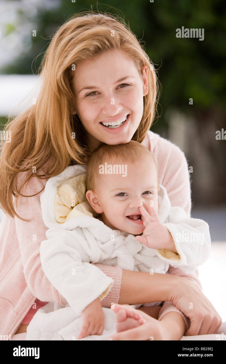Woman smiling with her daughter Stock Photo - Alamy