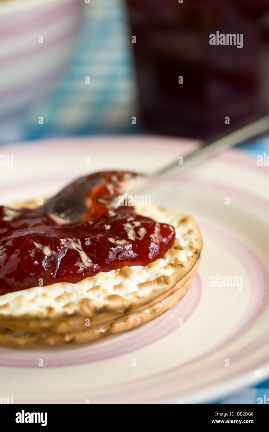 Delicious toast spread with strawberry jam for breakfast Stock Photo ...
