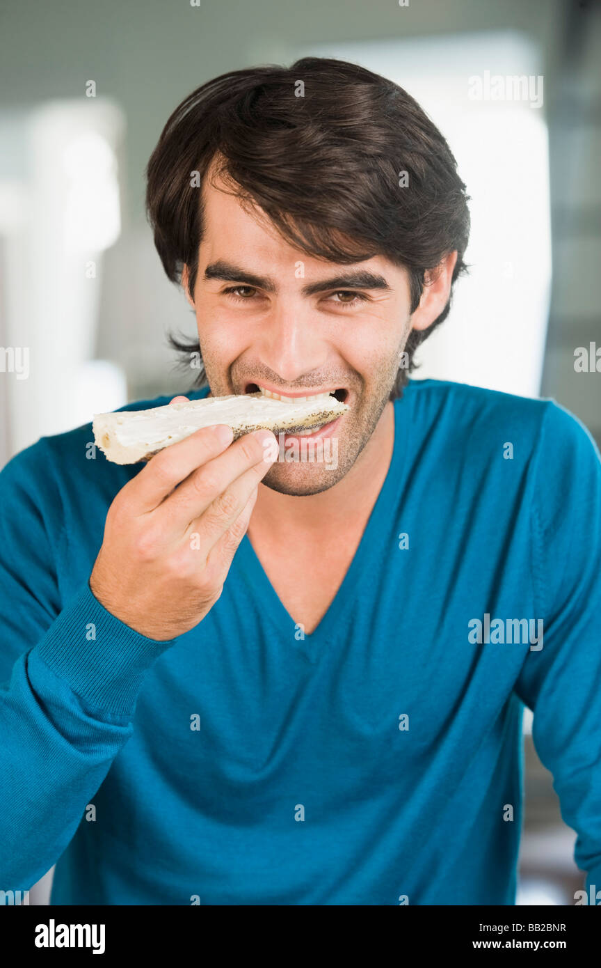Man eating a bread Stock Photo - Alamy