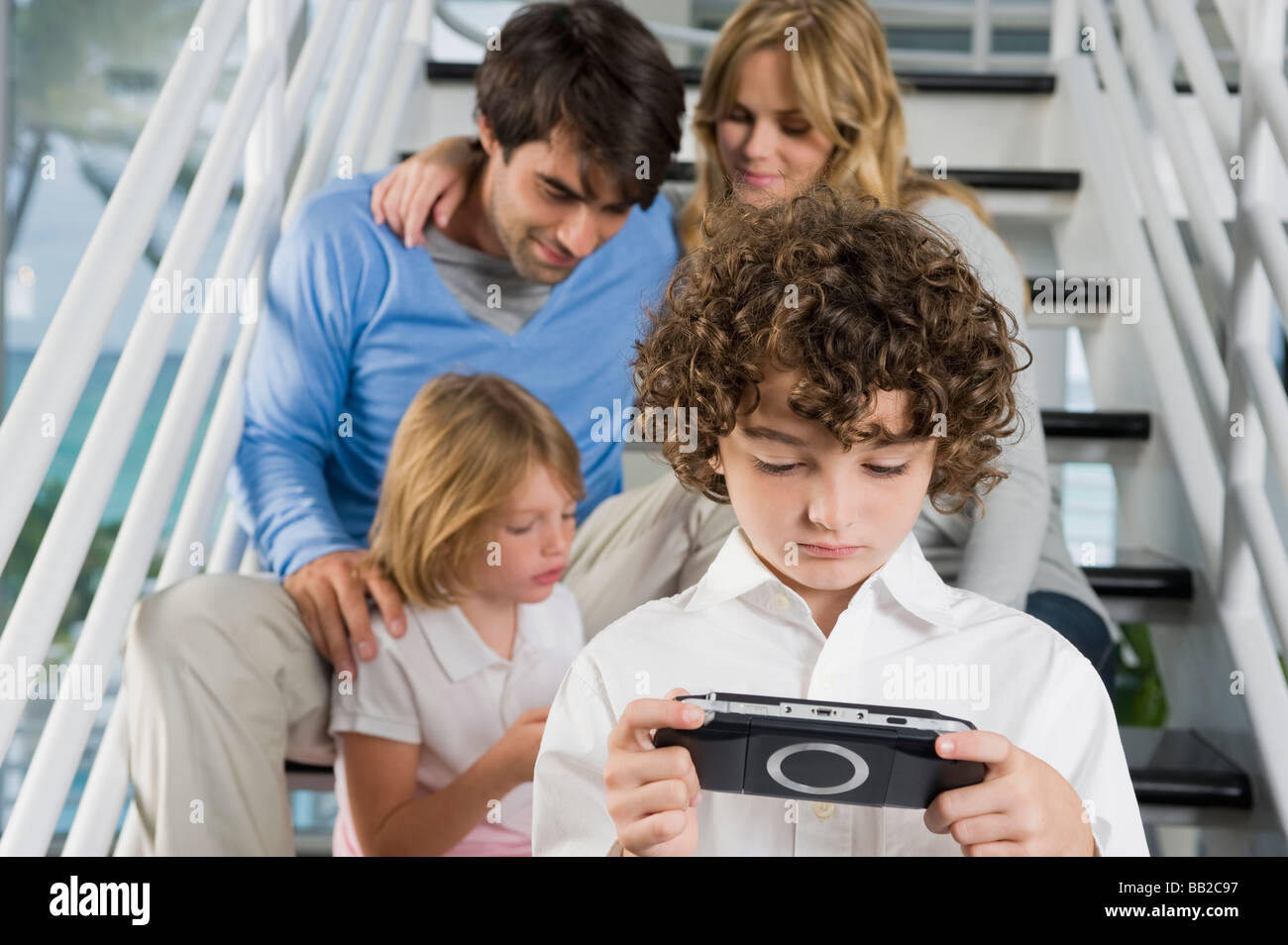 Children playing video games parents hi-res stock photography and ...