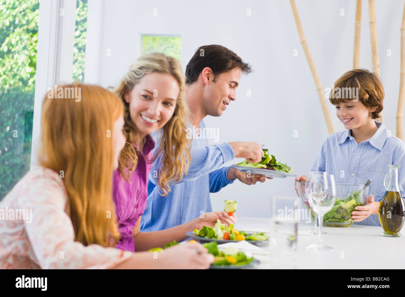 Family at the dining table Stock Photo - Alamy