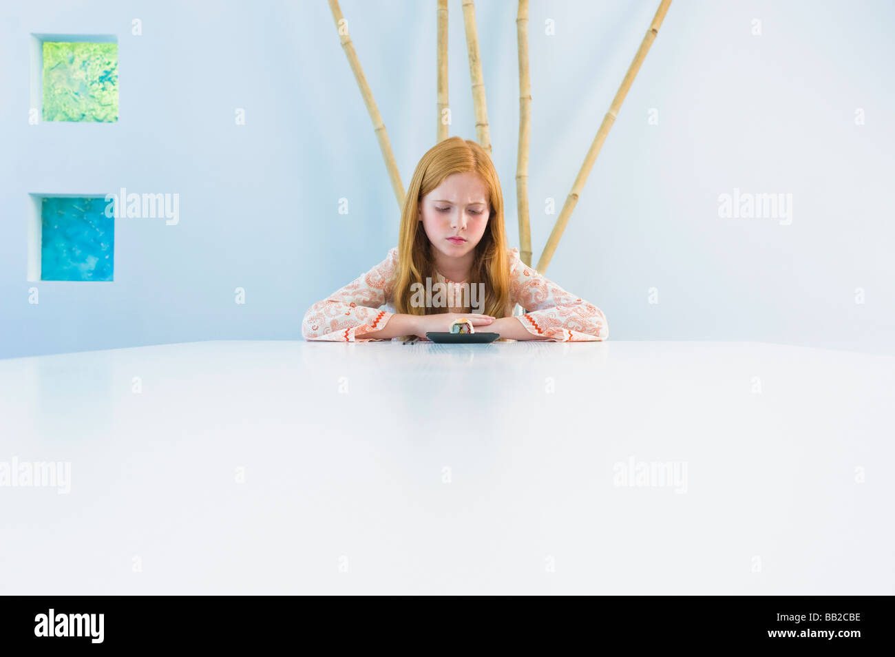 Girl at the dining table Stock Photo - Alamy