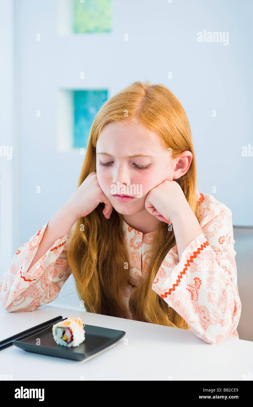 Girl at the dining table Stock Photo - Alamy