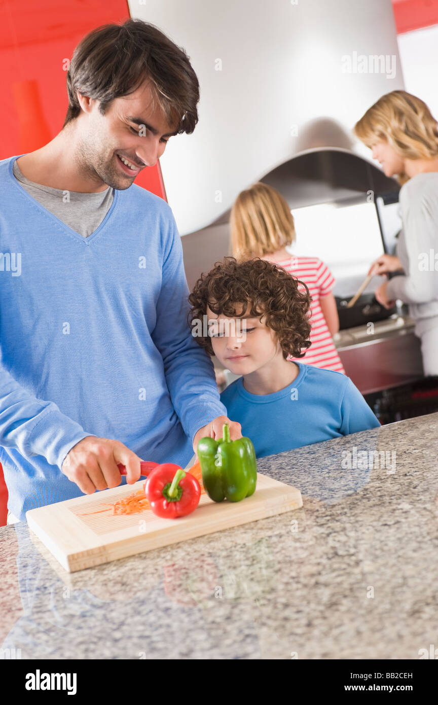 Family cooking food in the kitchen Stock Photo - Alamy