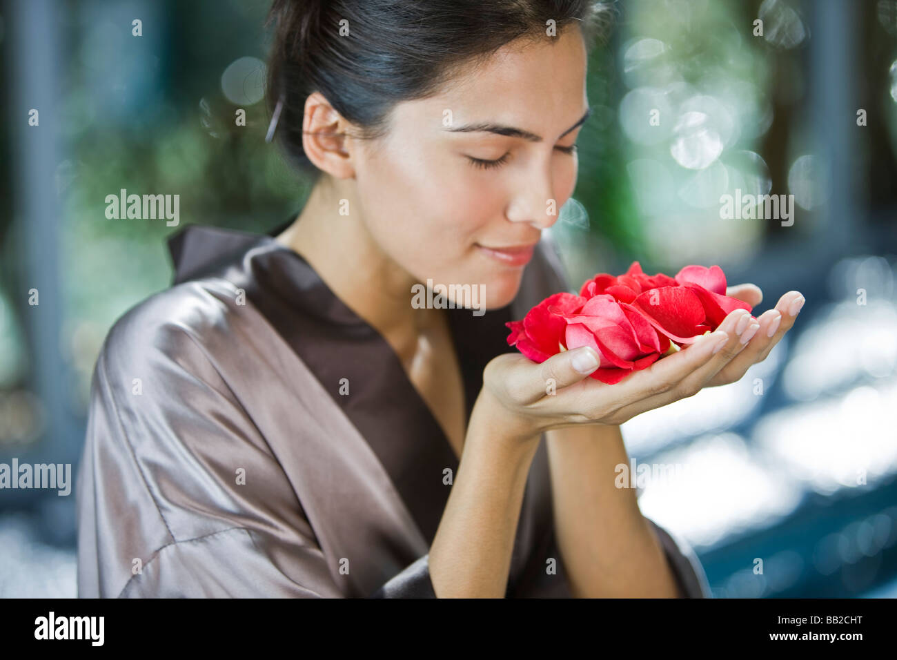 Woman smelling scented rose hi-res stock photography and images - Alamy