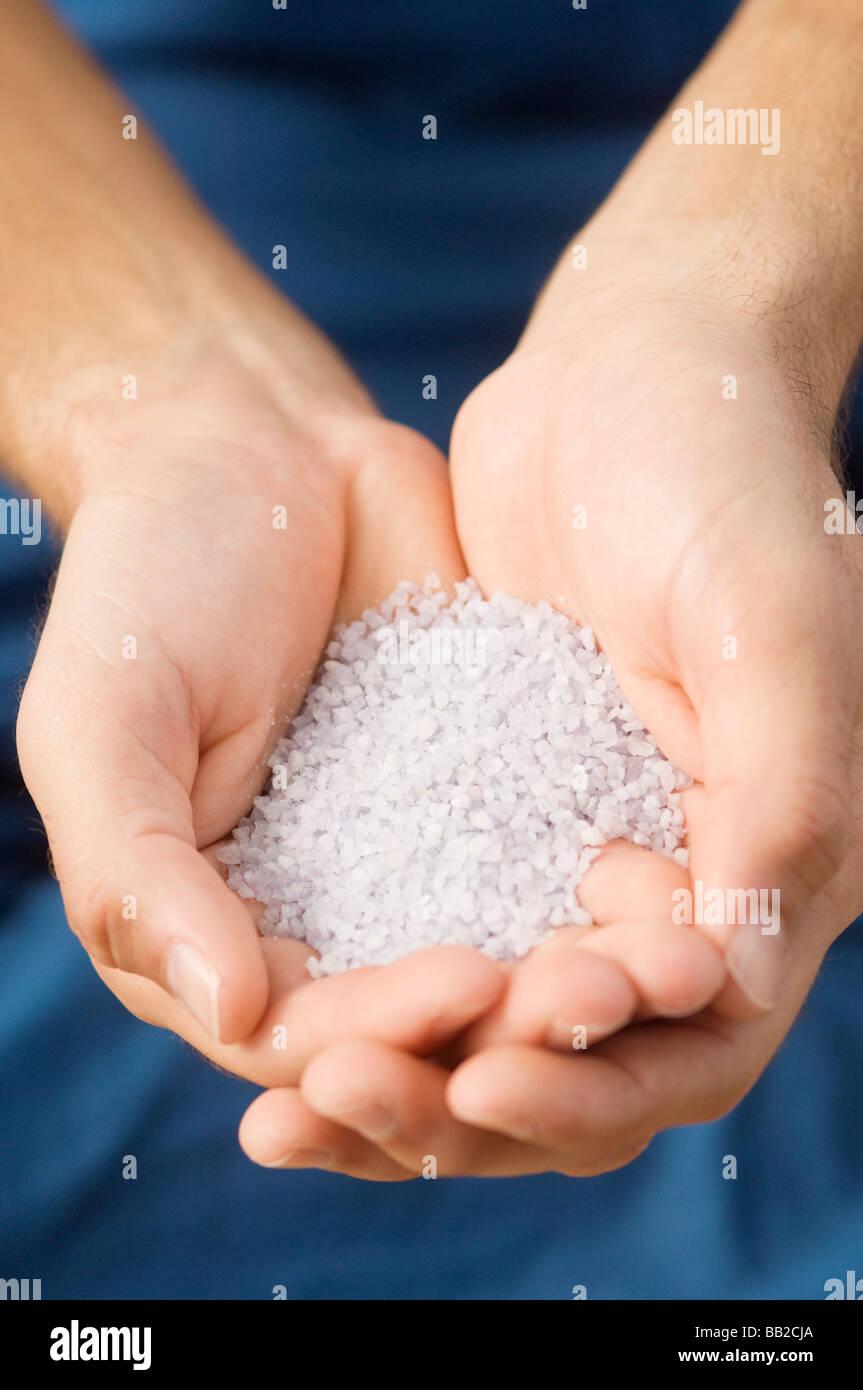 Close-up of a person's hand holding himalayan salt Stock Photo - Alamy