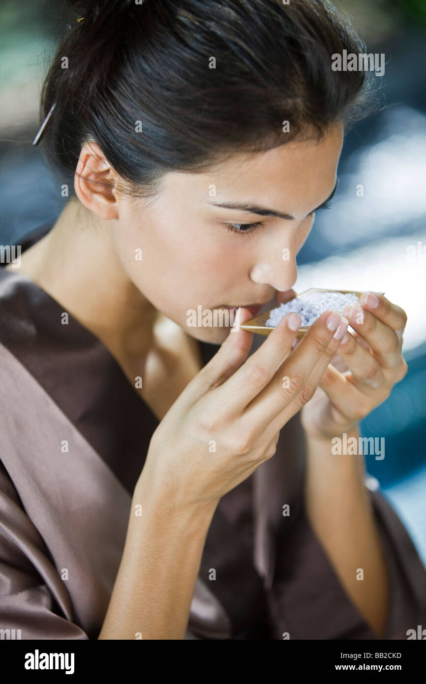 Woman smelling bath salt Stock Photo - Alamy