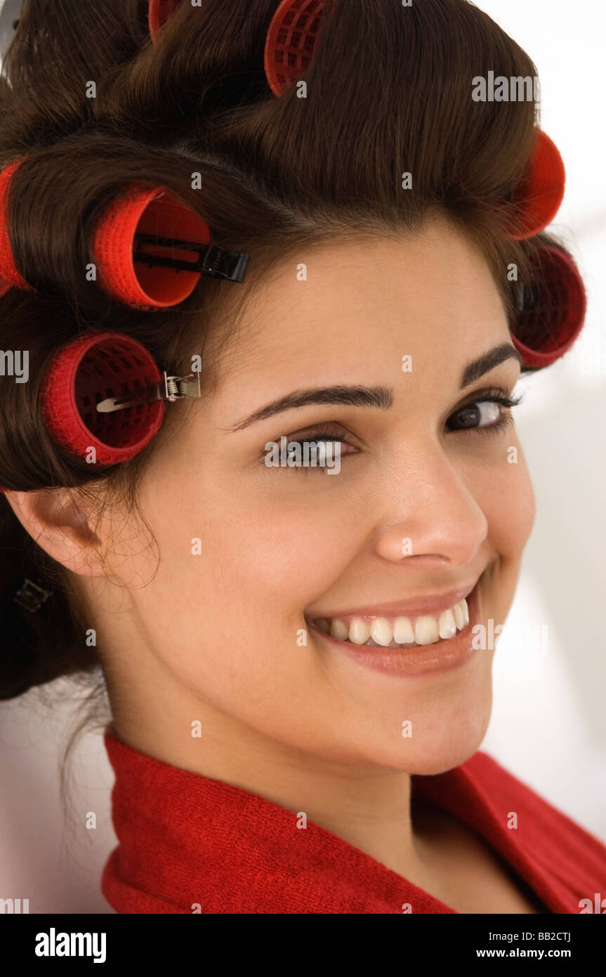 Portrait of a woman with curlers in her hair hi-res stock photography ...