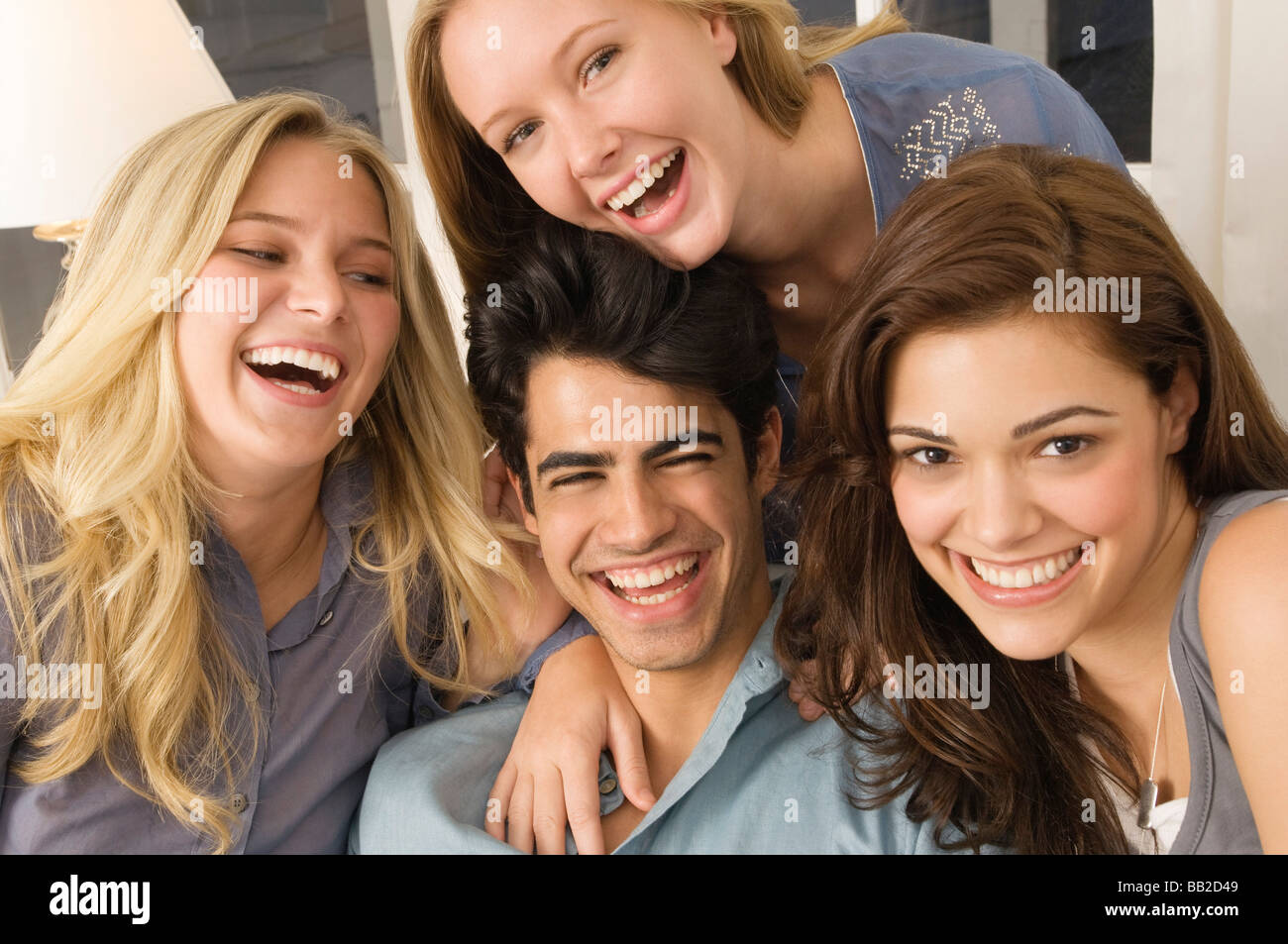 Portrait of four friends smiling Stock Photo - Alamy