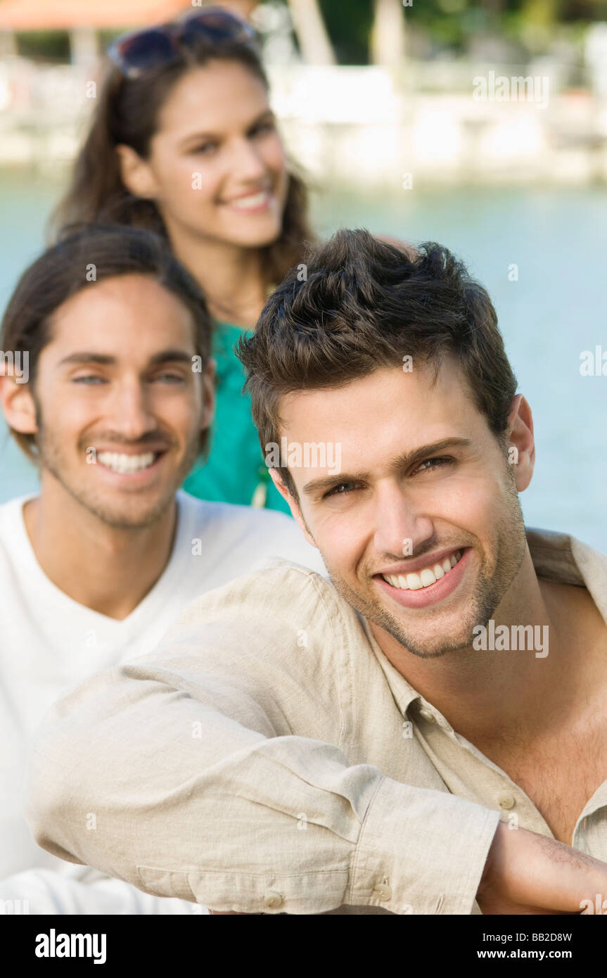 Portrait of three friends smiling Stock Photo - Alamy