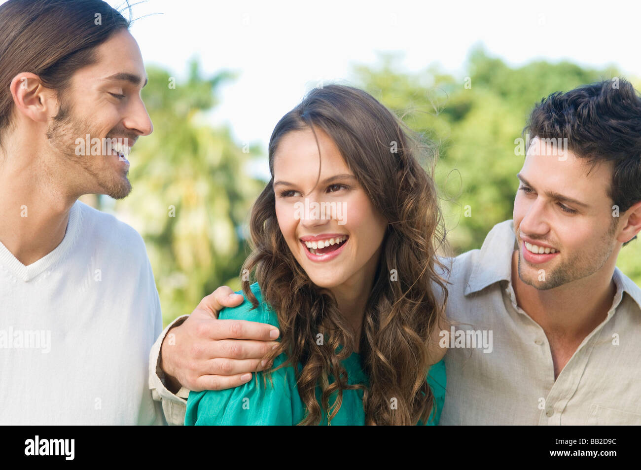 Three friends arm arm hi-res stock photography and images - Alamy