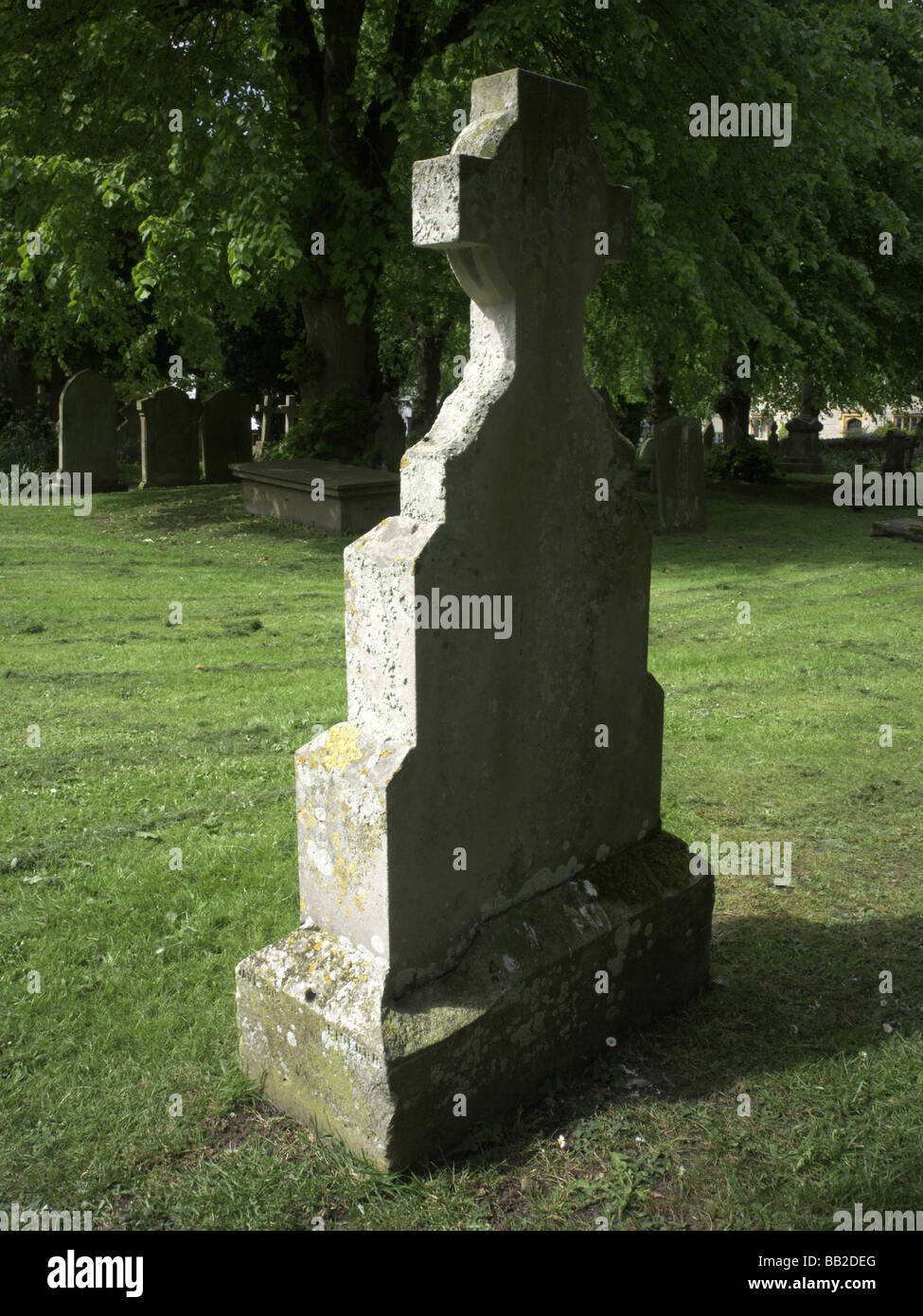 gravestones lit by the sun in a country cemetery Stock Photo - Alamy