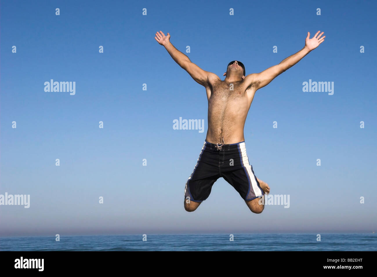 Man jumping on the beach Stock Photo - Alamy