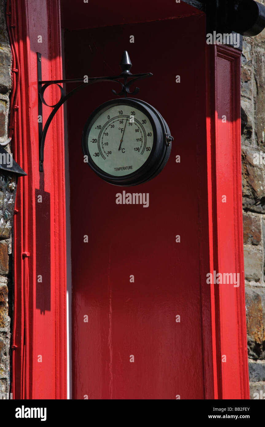 Barometer red front door Stock Photo - Alamy