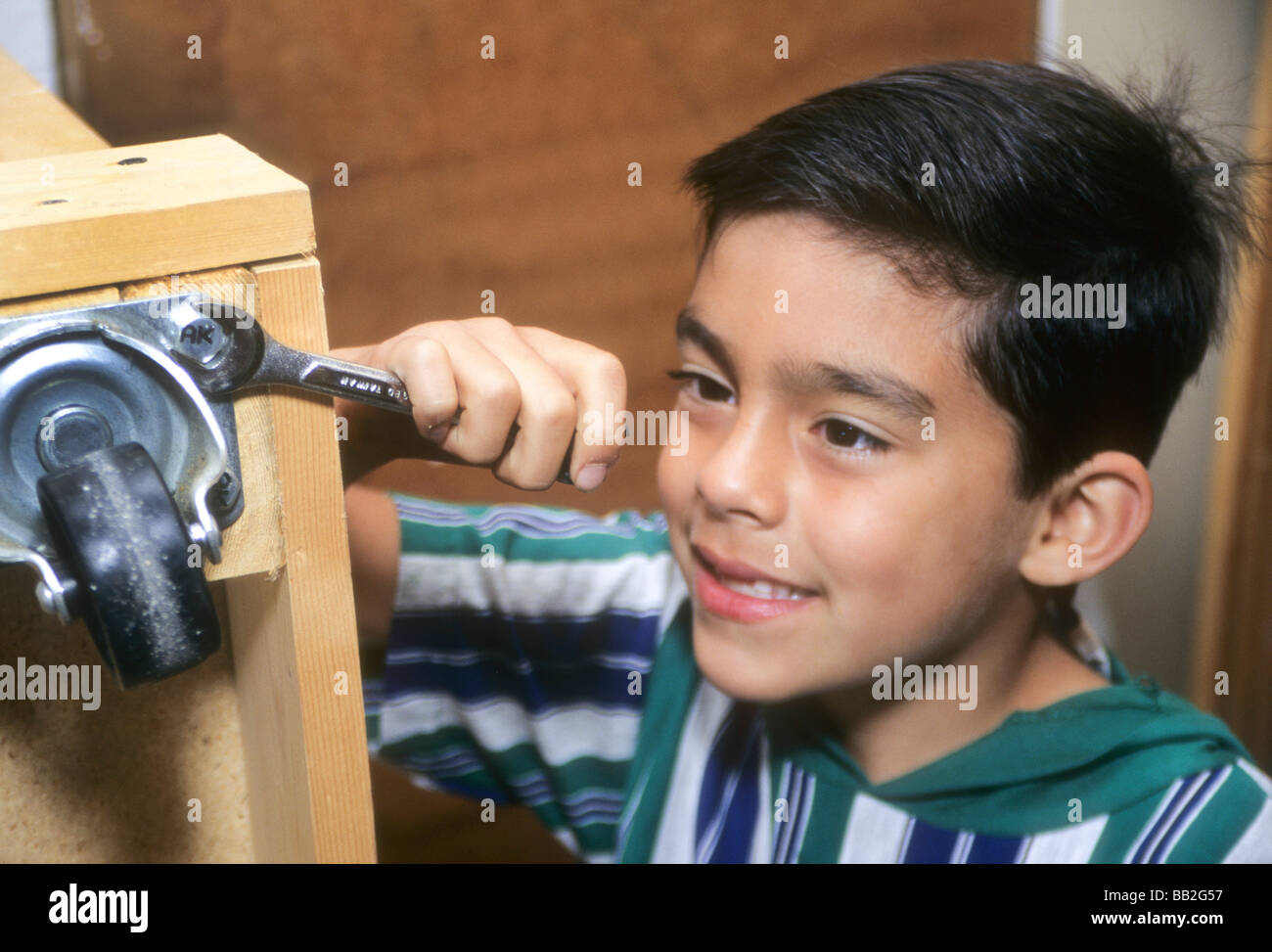 boy wrench tool work smile happy excite interest make build fix repair ...