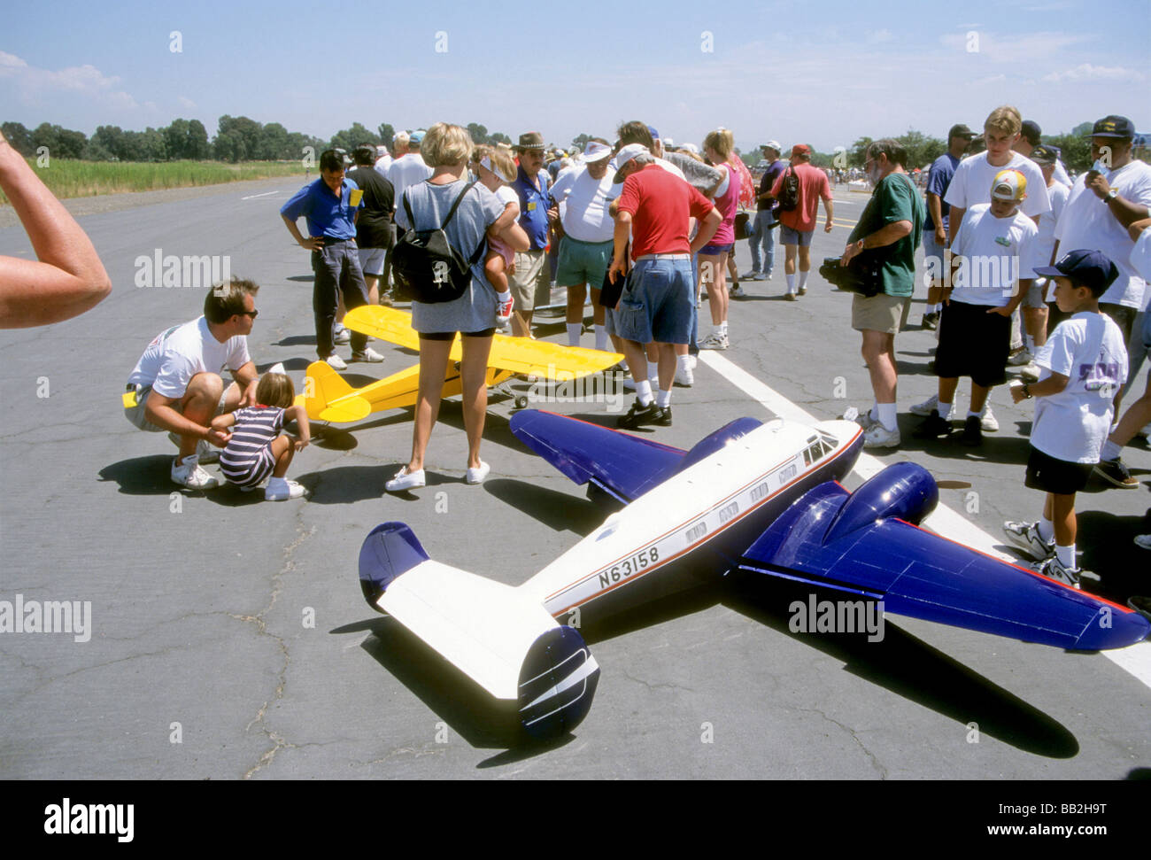 People look see observe watch model airplane plane aircraft toy ...