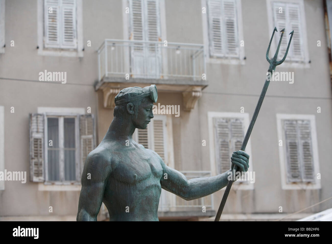 Traveling Croatia; a copper statue of a man with a trident Stock Photo ...