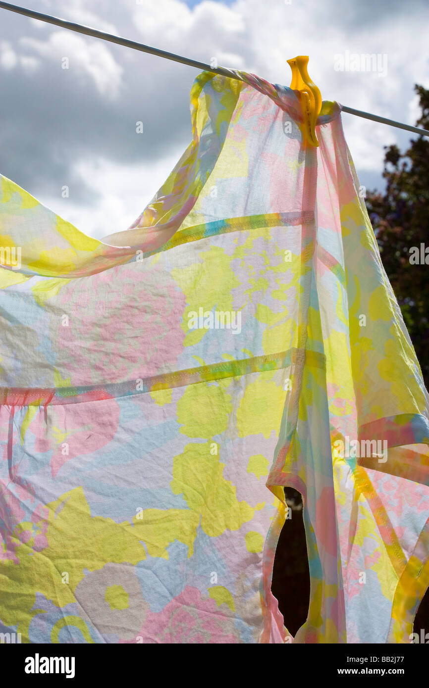 Washing hanging on line in sun with moody sky and clouds Stock Photo ...