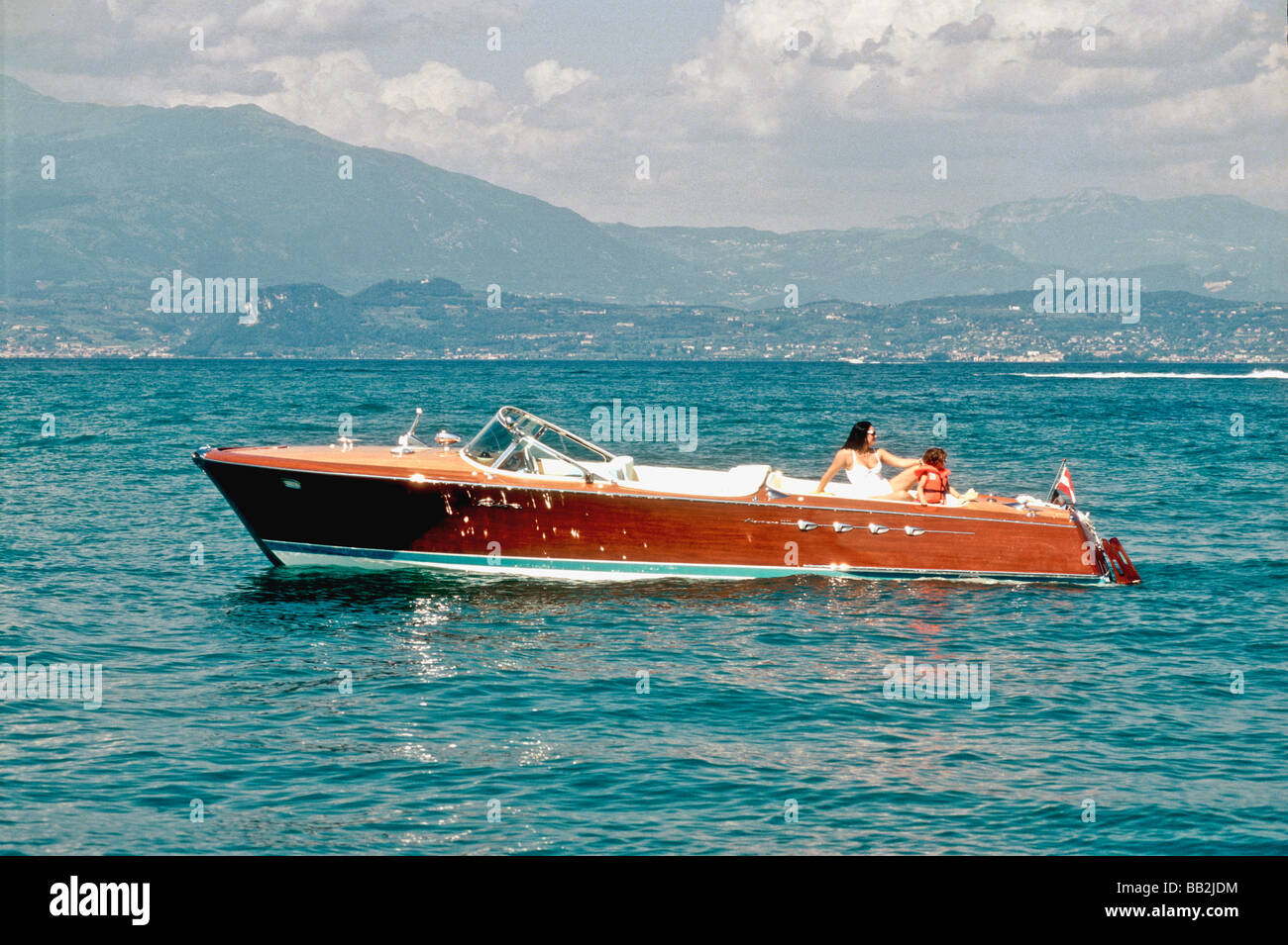 A woman and baby child aboard a Riva Super Aquarama speedboat Lake ...