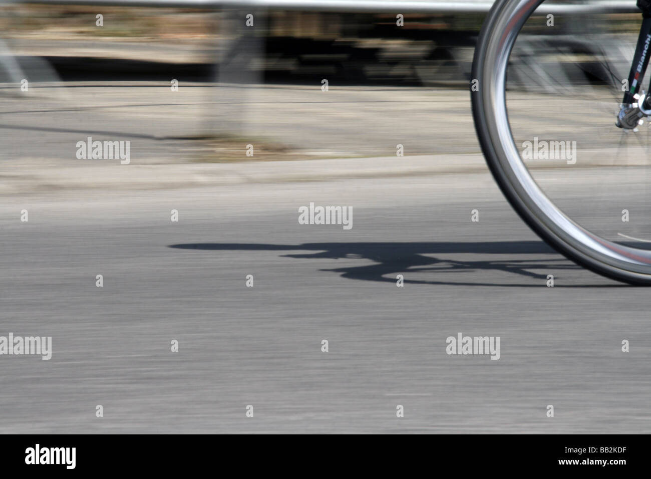 one single fast bike wheel in motion Stock Photo - Alamy