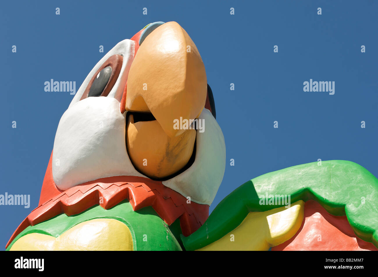Giant plastic parrot against blue sky Stock Photo - Alamy