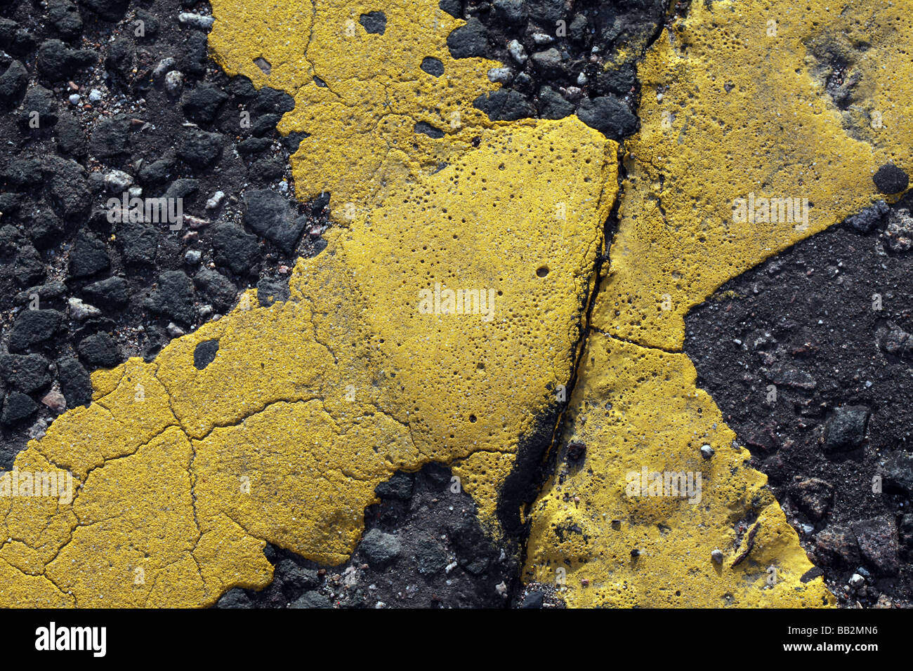 Yellow painted cross on road Stock Photo - Alamy