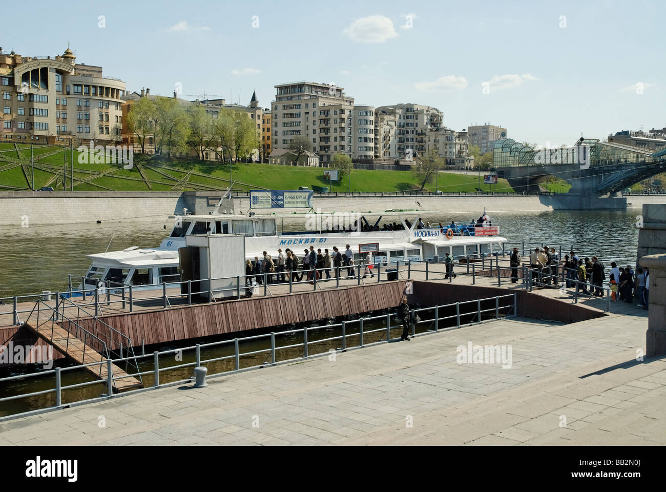 Moscow river embankment with tourist cruise boat Stock Photo - Alamy