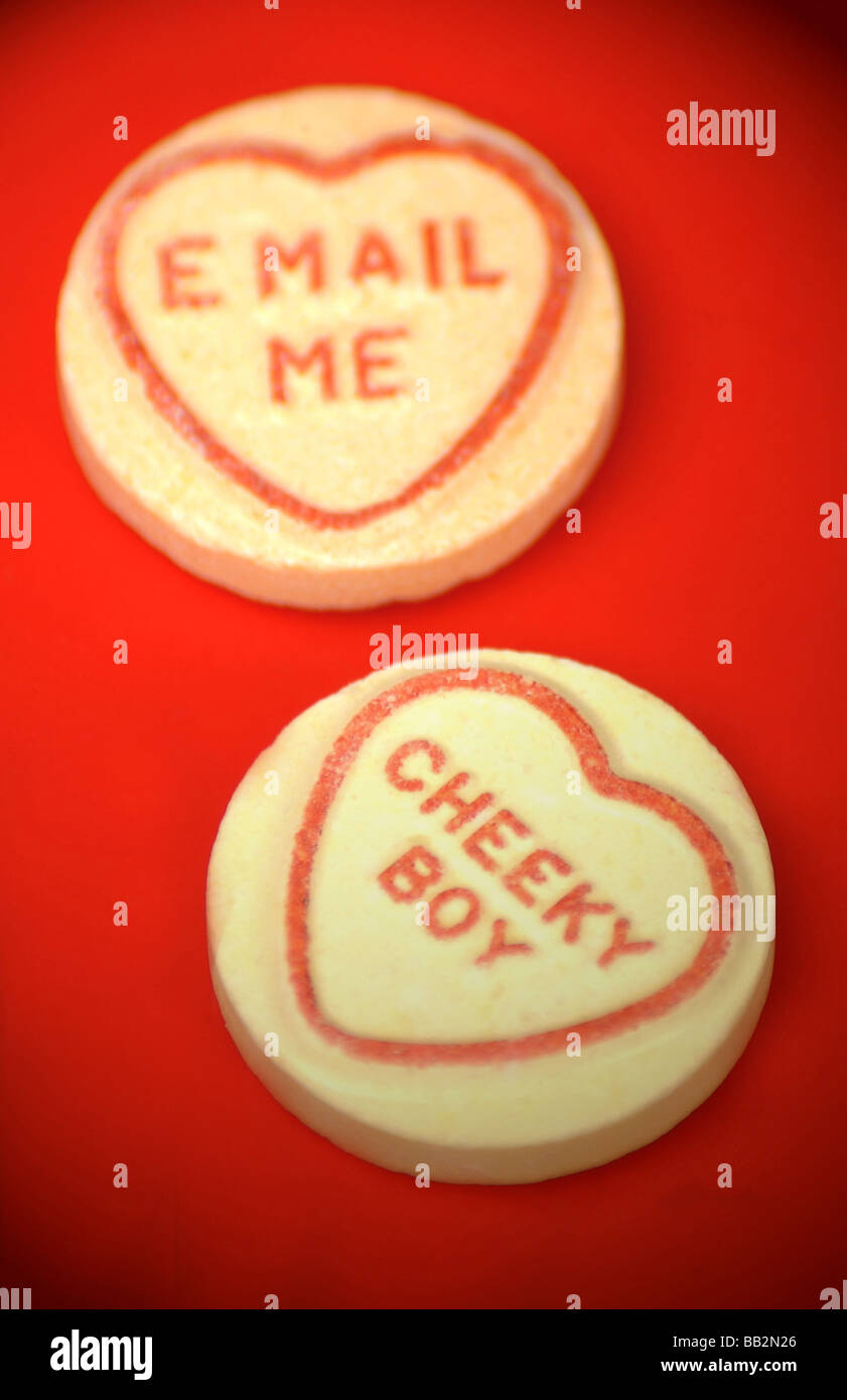 love heart sweets with different love messages Stock Photo - Alamy